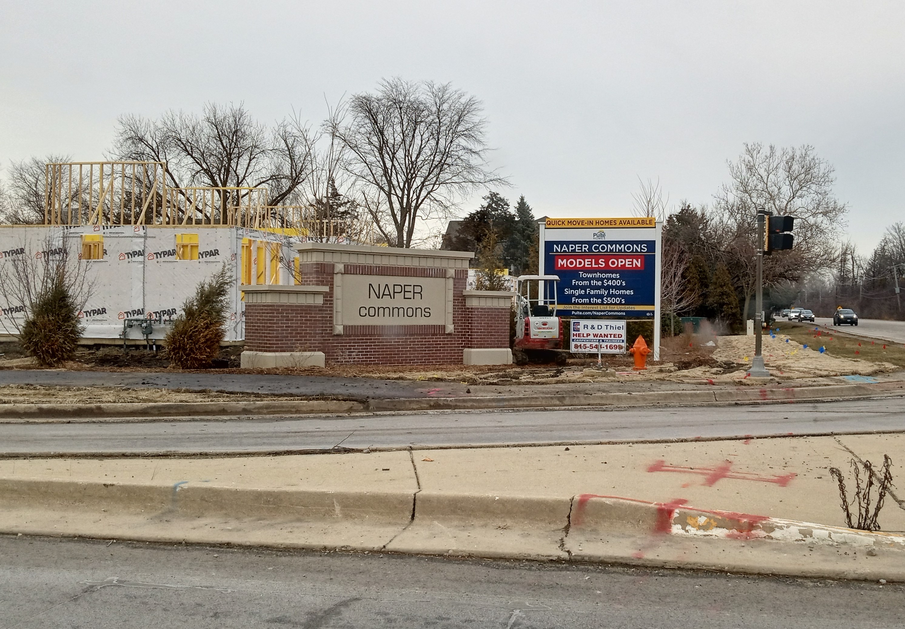 The mixed messages of a new subdivision sign with red brick but a ...